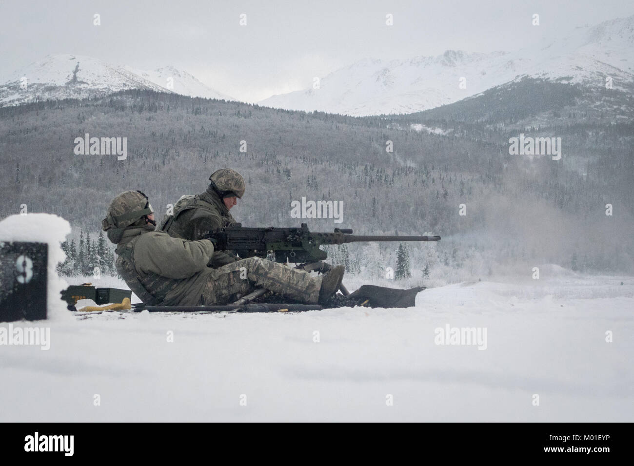 Airmen assigned to the 673d Security Forces Squadron conduct an M2 .50 ...