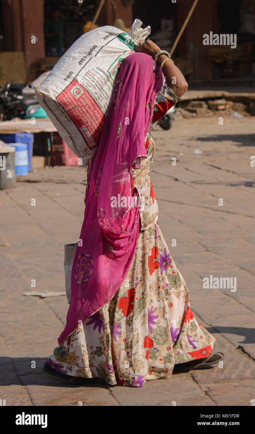 Woman carrying heavy load in hi-res stock photography and images - Alamy