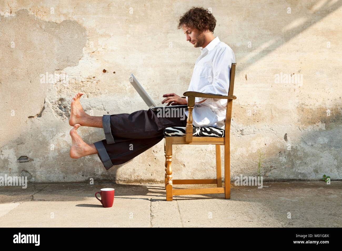 the courtyard of old factory building, portrait of a young man Stock ...