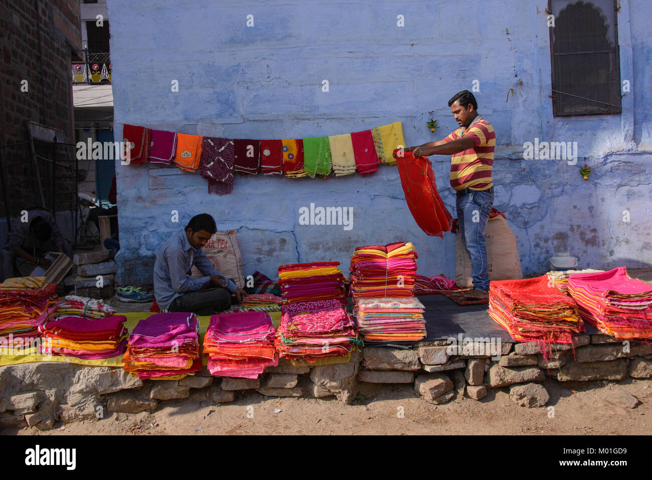 Selling textiles in the blue town of Jodhpur, Rajasthan, India Stock ...