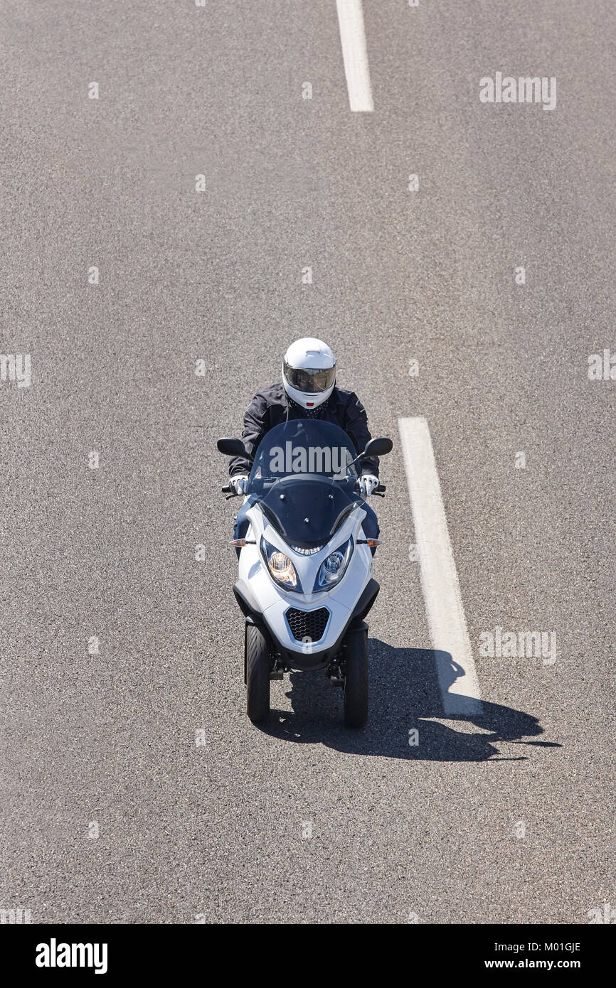 Motorcycle rider on the road. Travel and fun background. Vertical Stock ...