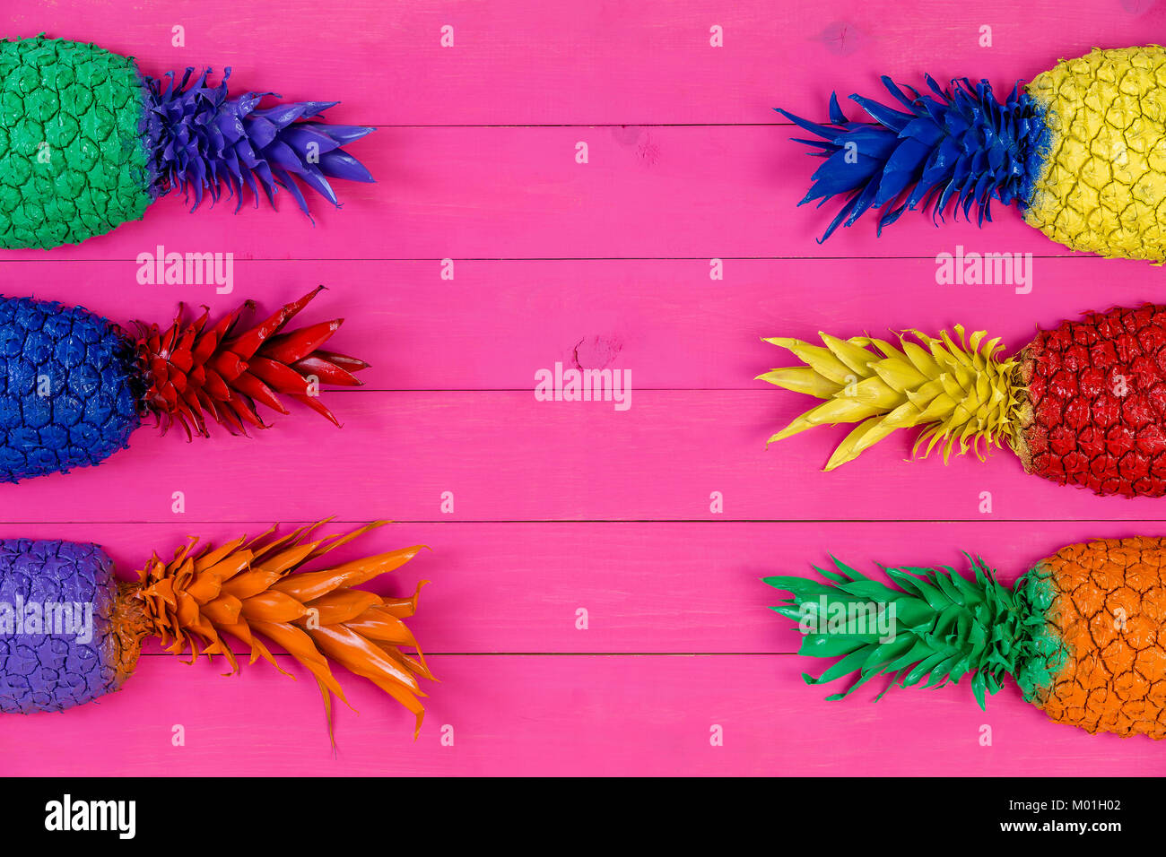Six brightly colored pineapple tops with leaves in the colors of the ...