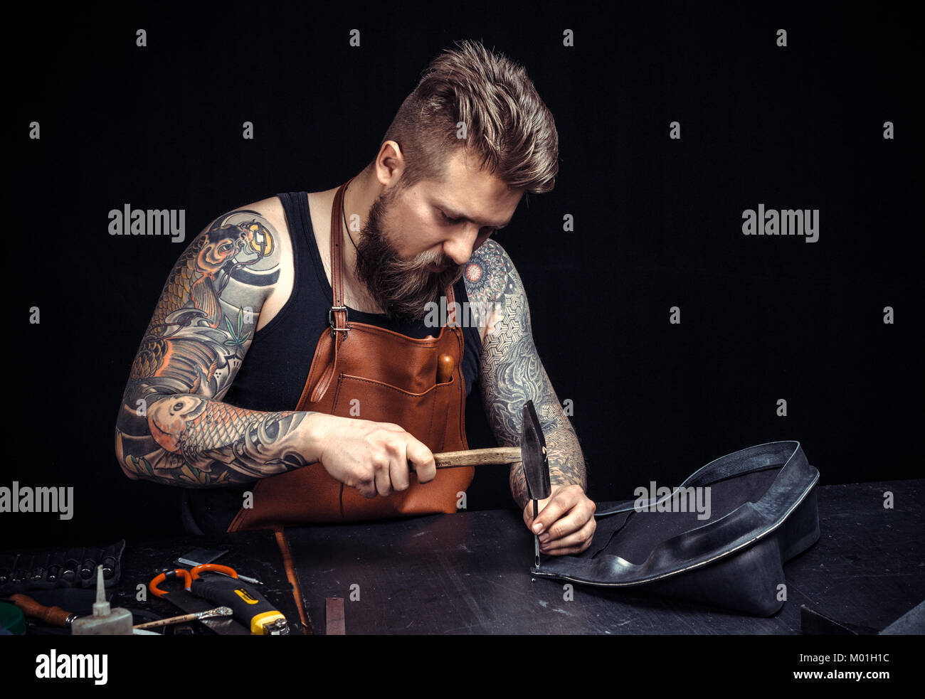 Artist working with leather works with leather goods./Leather workman ...