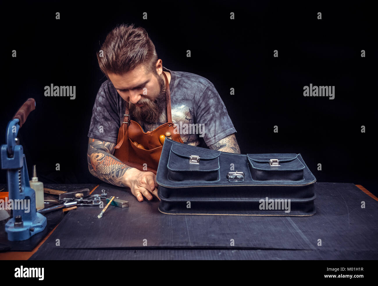 Leather Craftsman creates quality product of leather in the shop ...