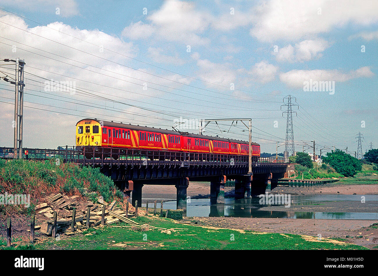 Class 302 mail unit number 302990 heads south along the Great Eastern ...