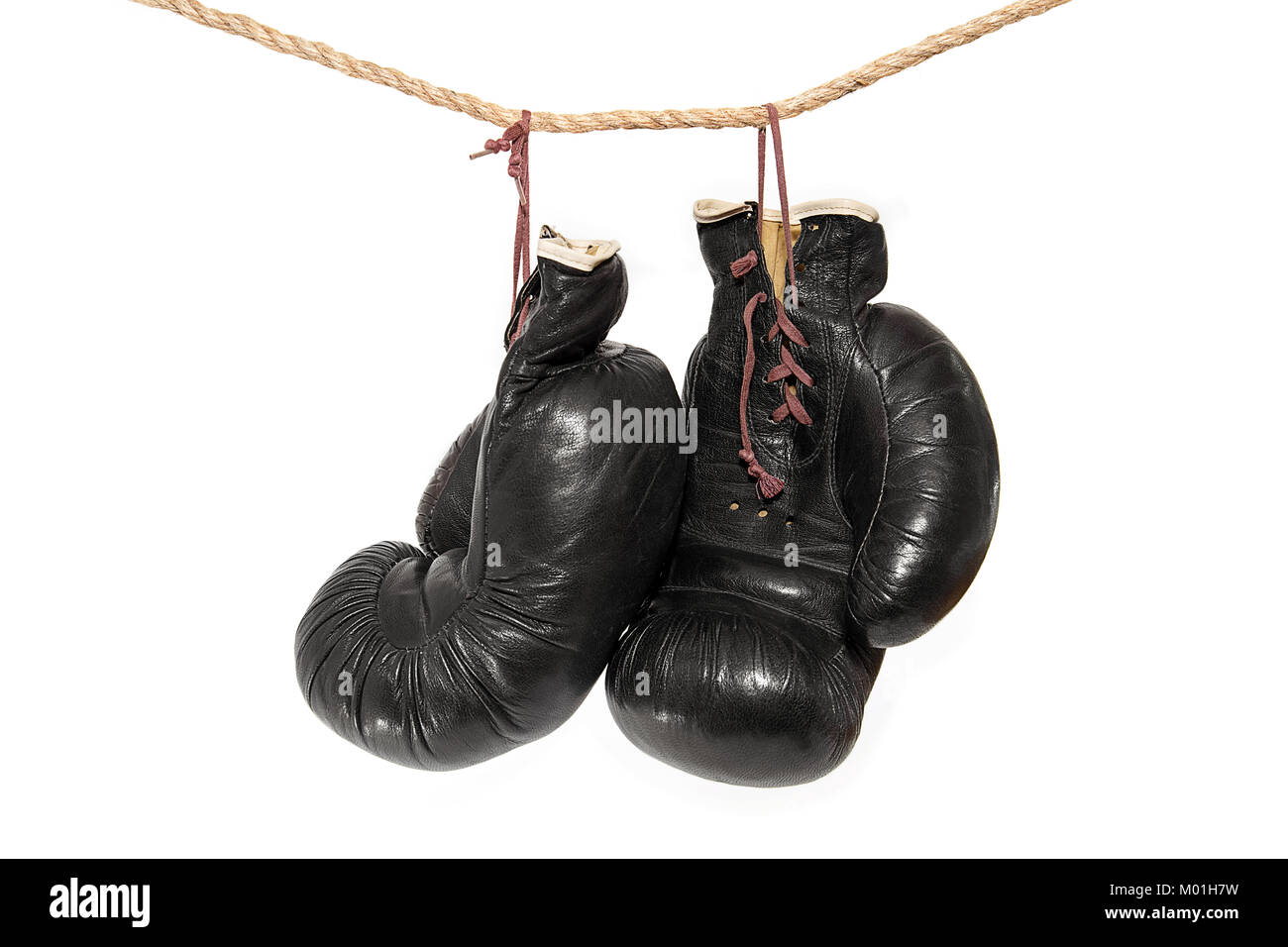 Old boxing gloves hanging on a rope on a white background Stock Photo ...