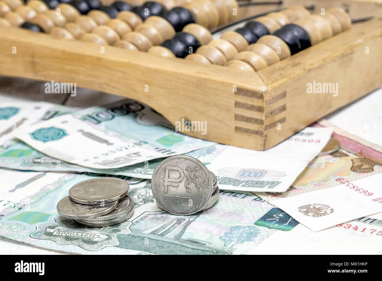 Iron ruble, paper bills and old abacus. Business still life Stock Photo ...
