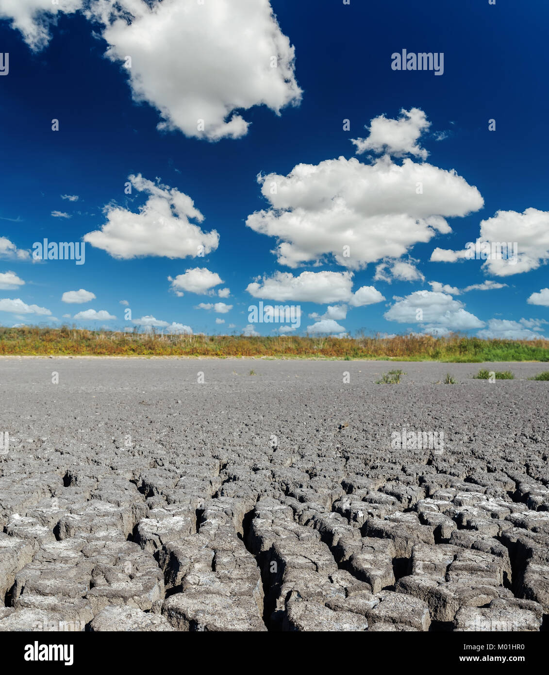 global warming. deep blue sky with clouds over drought earth Stock ...