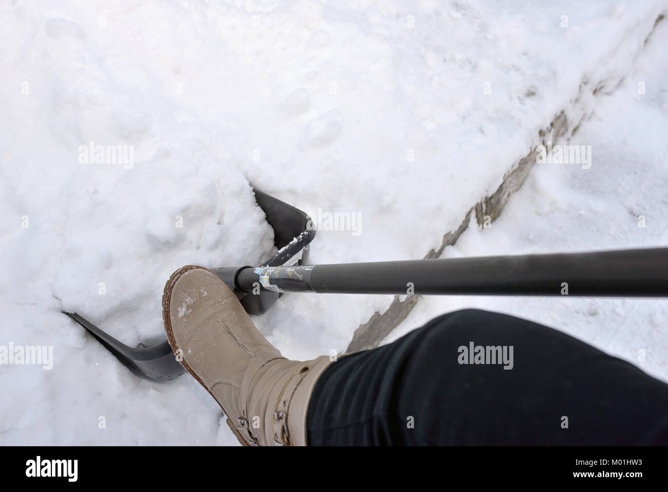 Woman shoveling snow hi-res stock photography and images - Alamy