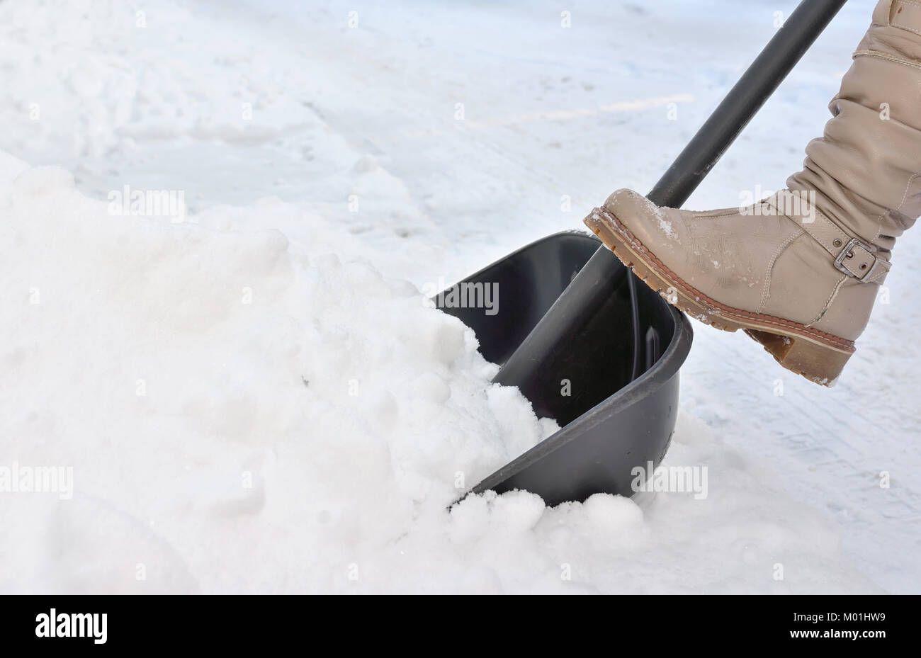 Woman shoveling snow shovel hi-res stock photography and images - Alamy