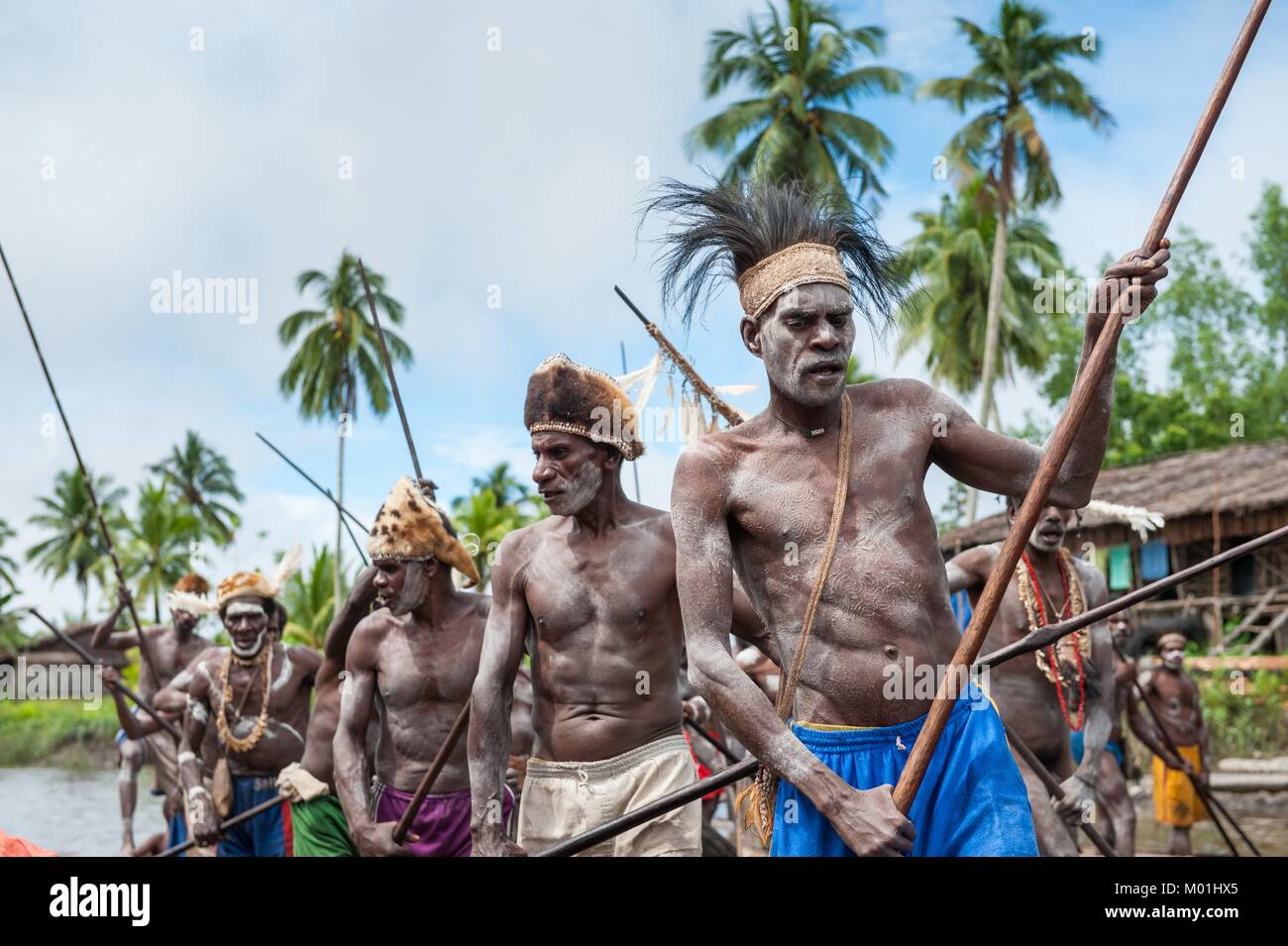 Canoe war ceremony of Asmat people. Headhunters of a tribe of Asmat ...
