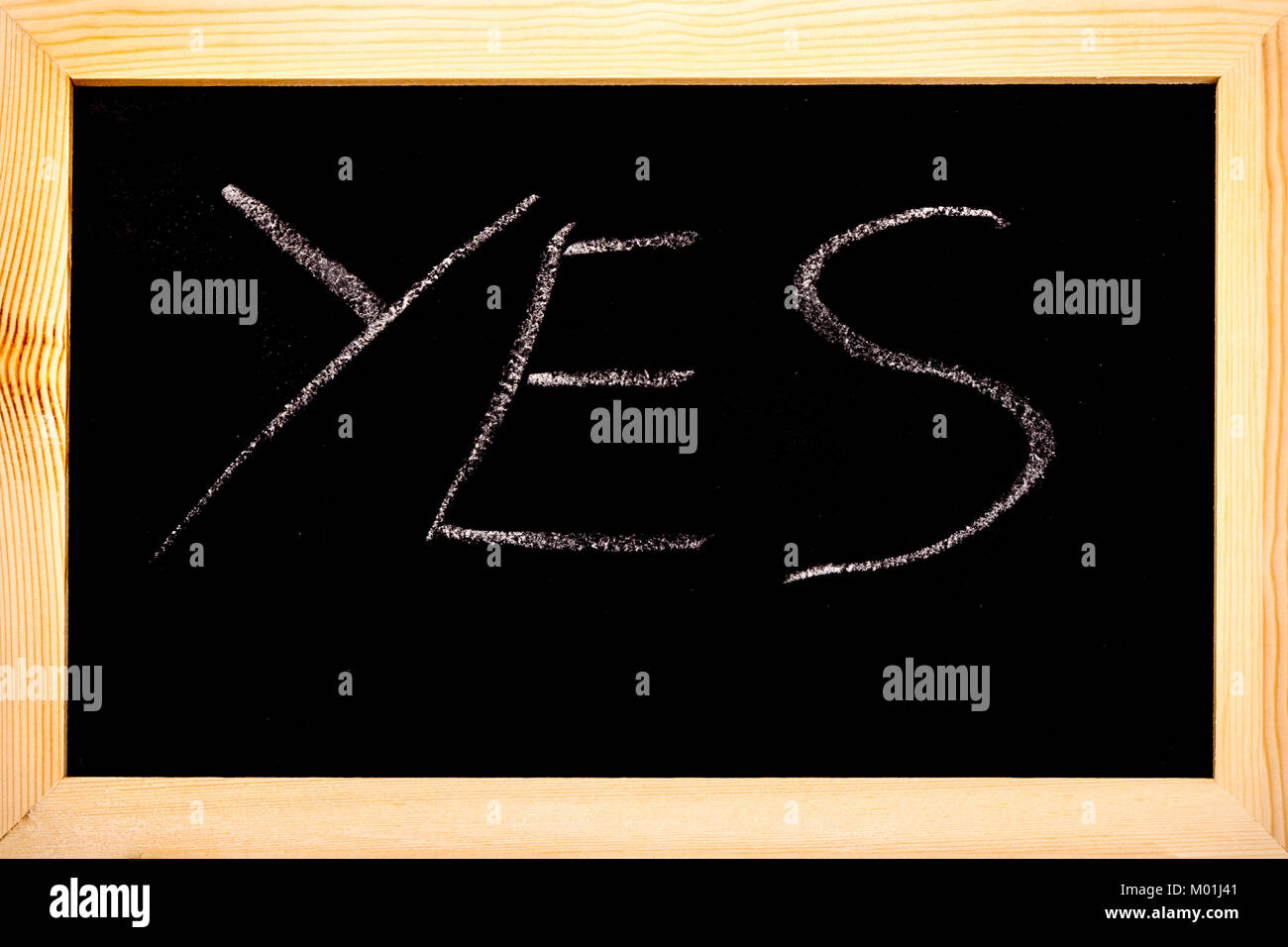 Blackboard with yes written on in white chalk Stock Photo - Alamy
