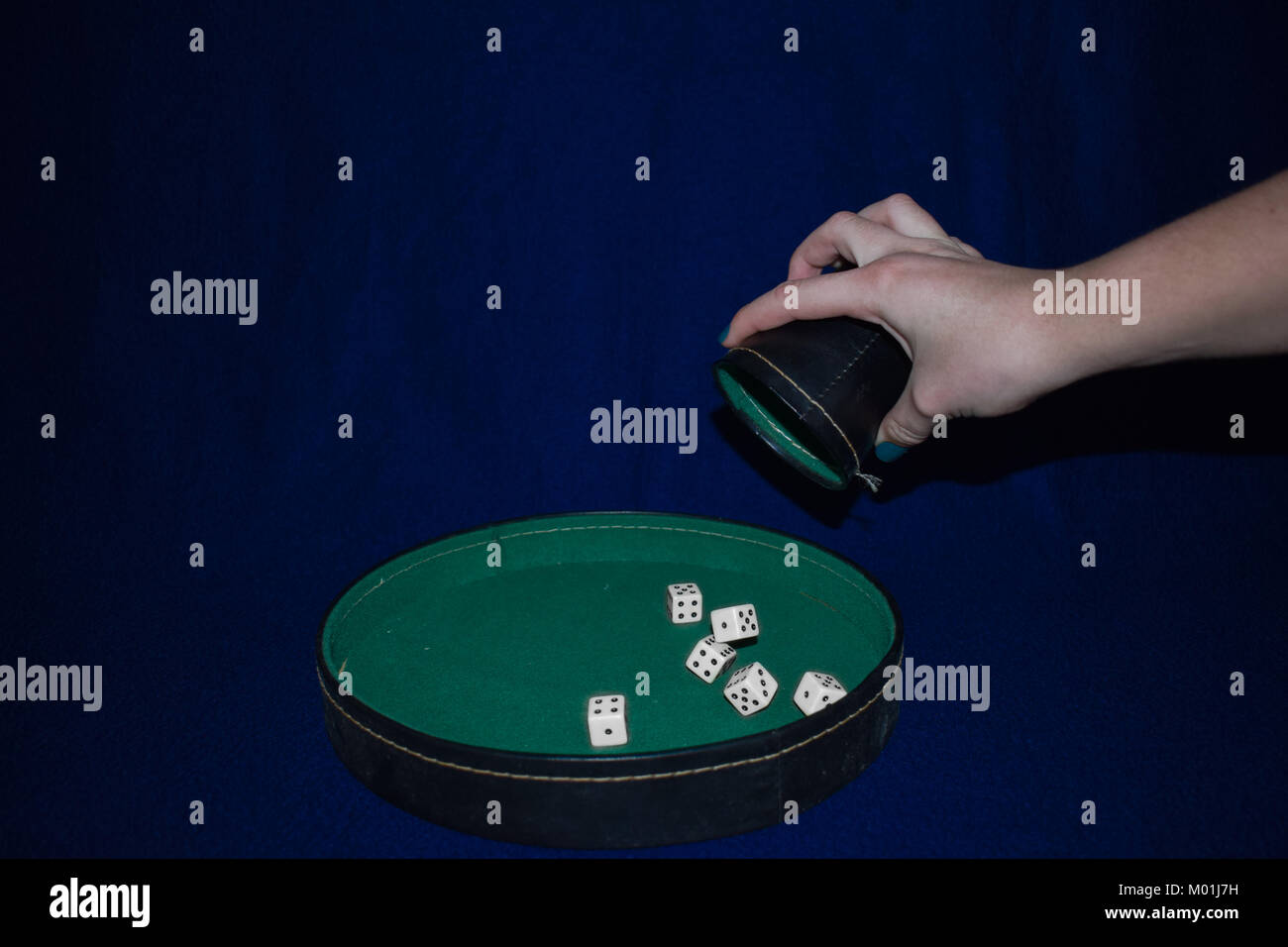 Rolling dice hi-res stock photography and images - Alamy