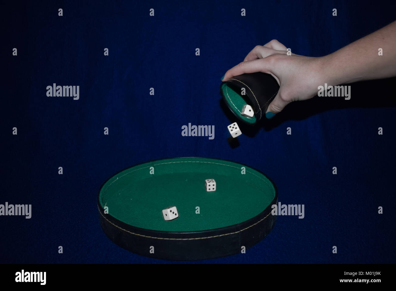 Woman rolling dice hi-res stock photography and images - Alamy