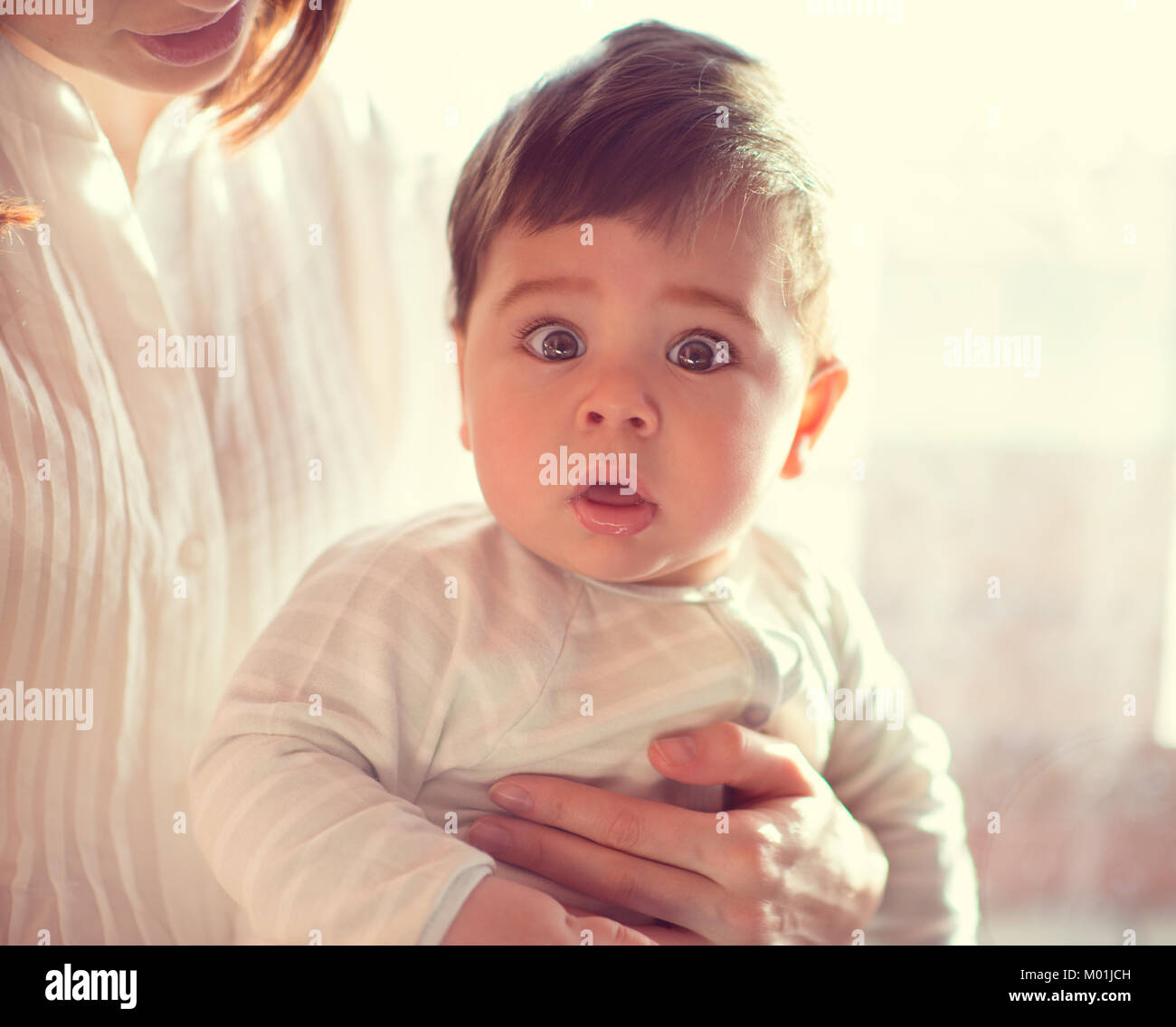 Sweet portrait of happy beautiful mother and baby Stock Photo - Alamy