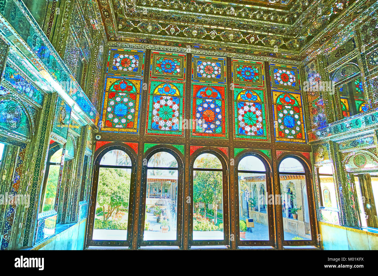 SHIRAZ, IRAN - OCTOBER 12, 2017: The stained-glass windows in mirror ...