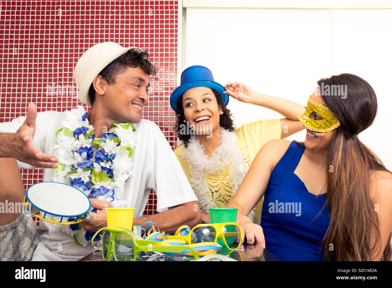 Party people talk animatedly on holiday. Multi ethnic group of teenage ...