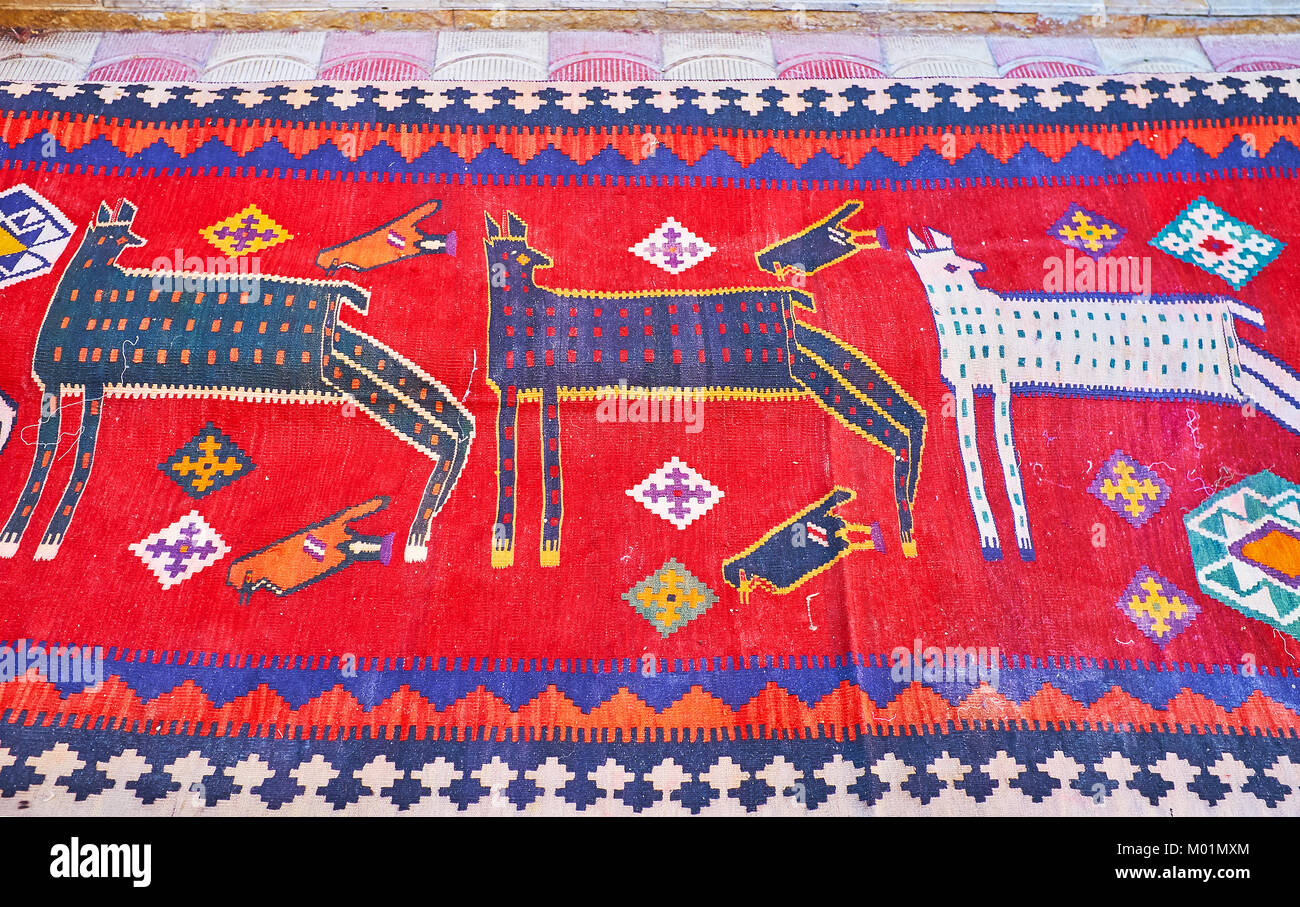 Details of pattern of antique nomadic tribal carpet - colored animals ...