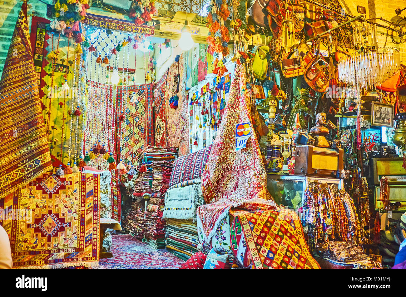 SHIRAZ, IRAN - OCTOBER 12, 2017: Scenic carpet stall with colored ...
