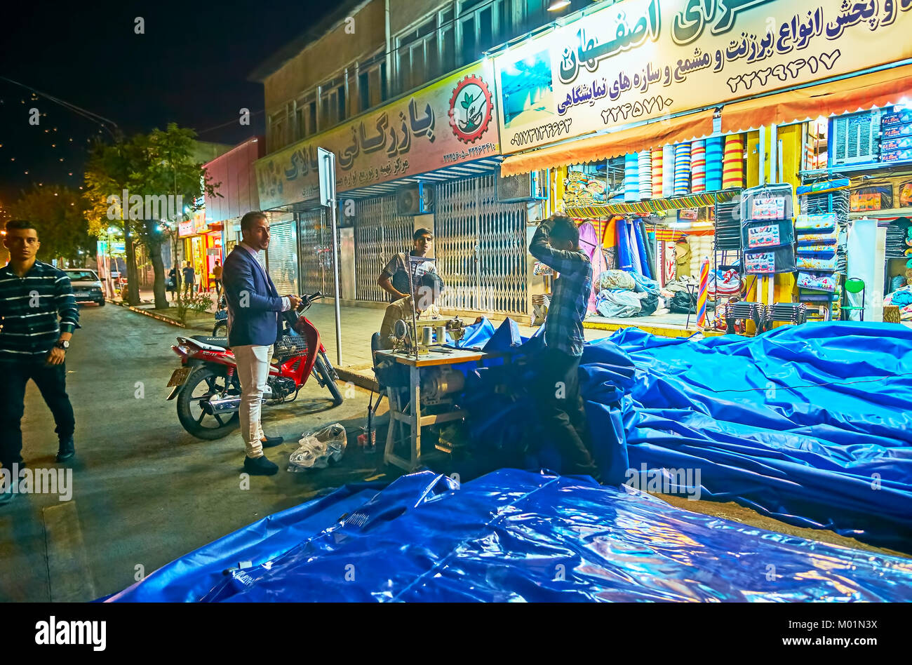 SHIRAZ, IRAN - OCTOBER 12, 2017: The tailor with sewing machine ...