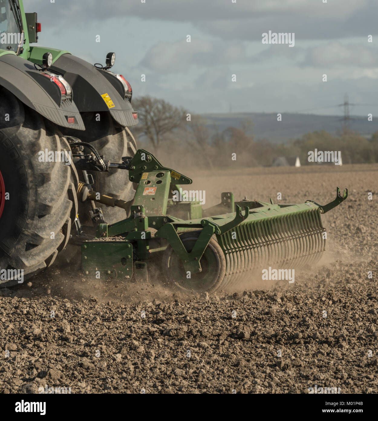 Detail of spring soil cultivation using a power harrow to prepare the ...