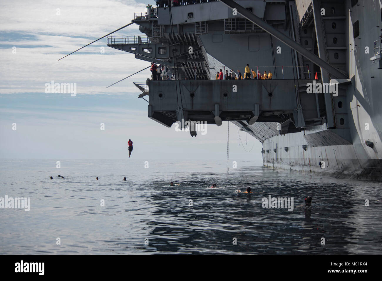 ATLANTIC OCEAN (Aug. 2, 2017) A Sailor jumps from aircraft elevator 4 ...