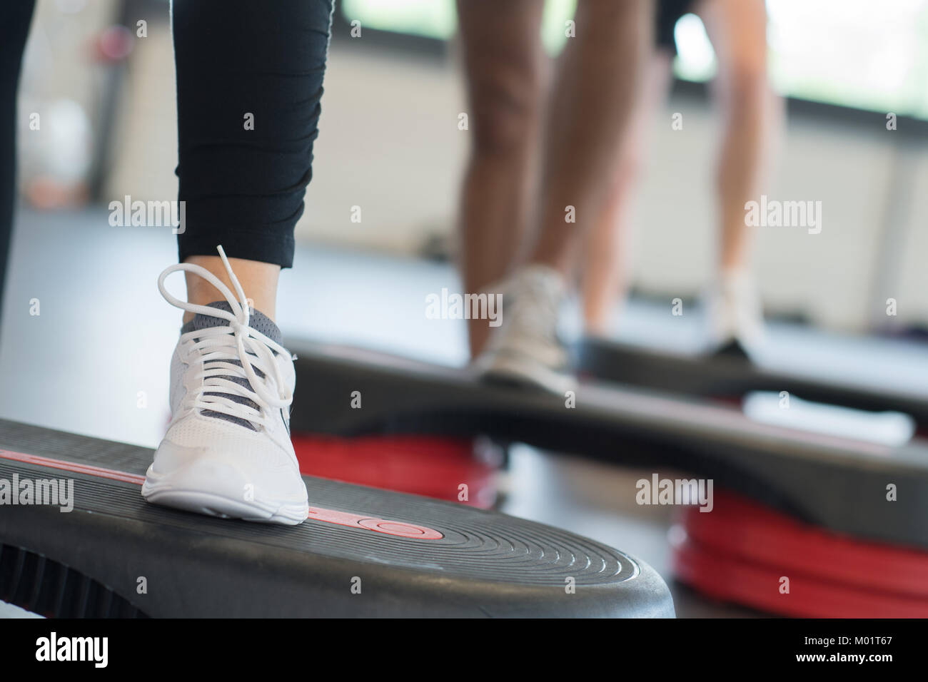 close up of feet on step during exercise class Stock Photo - Alamy