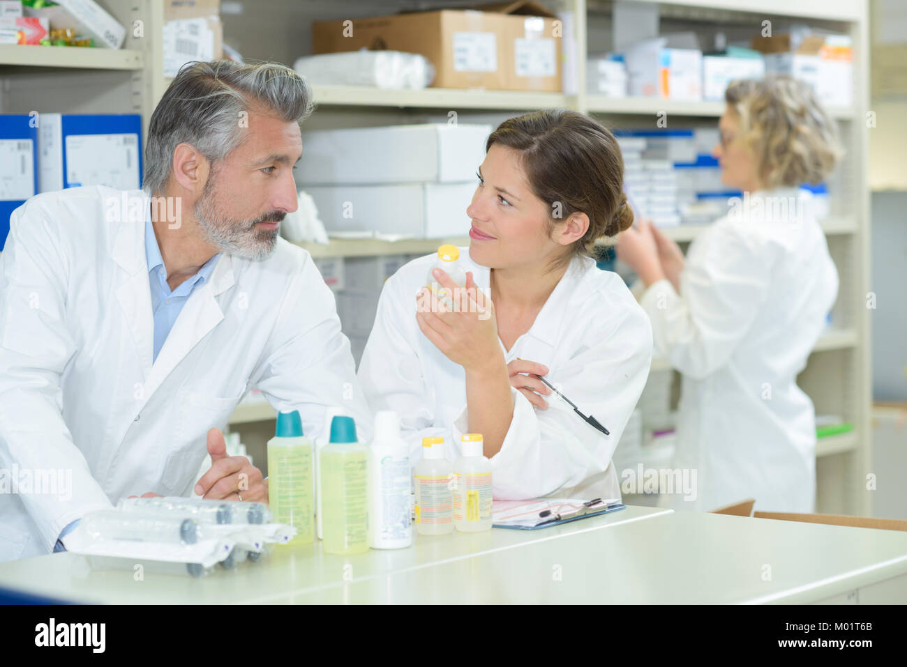 Pharmacists in discussion Stock Photo - Alamy