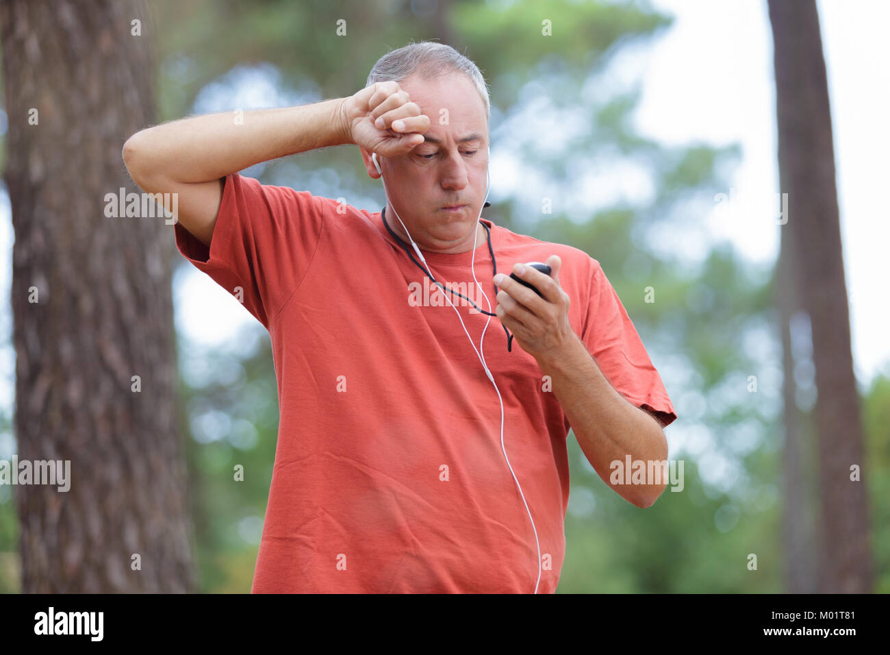 tired man in the woods Stock Photo - Alamy