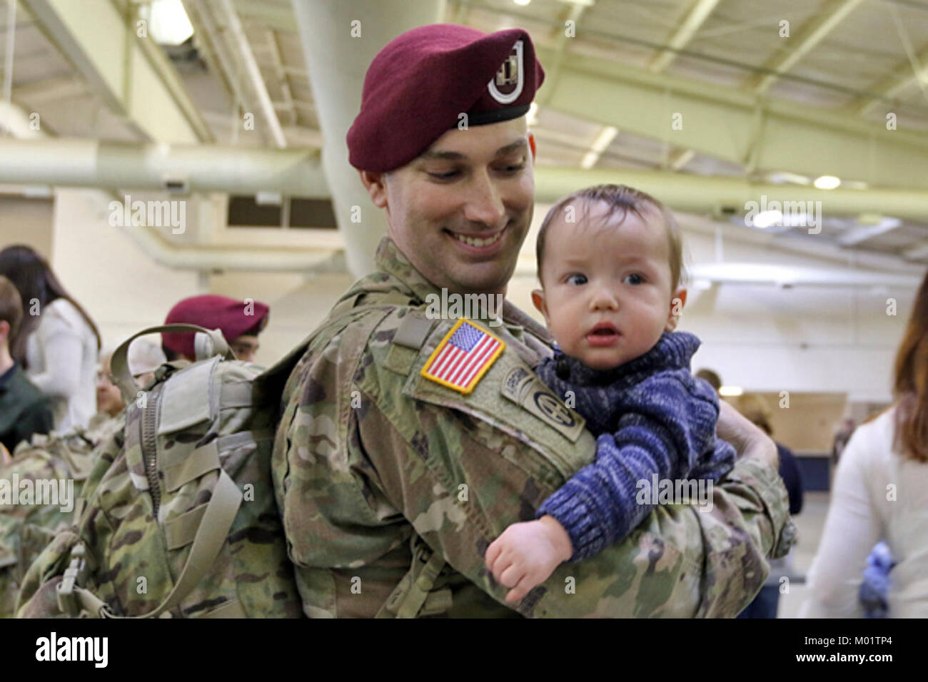 After returning home from a 9-month deployment, a paratrooper, assigned ...