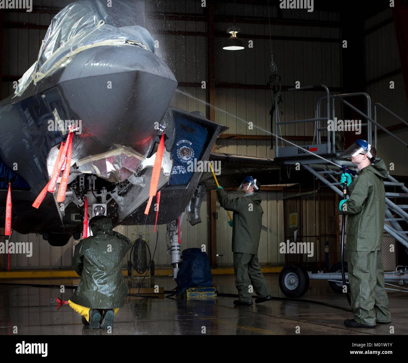 U.S. Air Force Col. Paul D. Moga, 33rd Fighter Wing commander, center ...