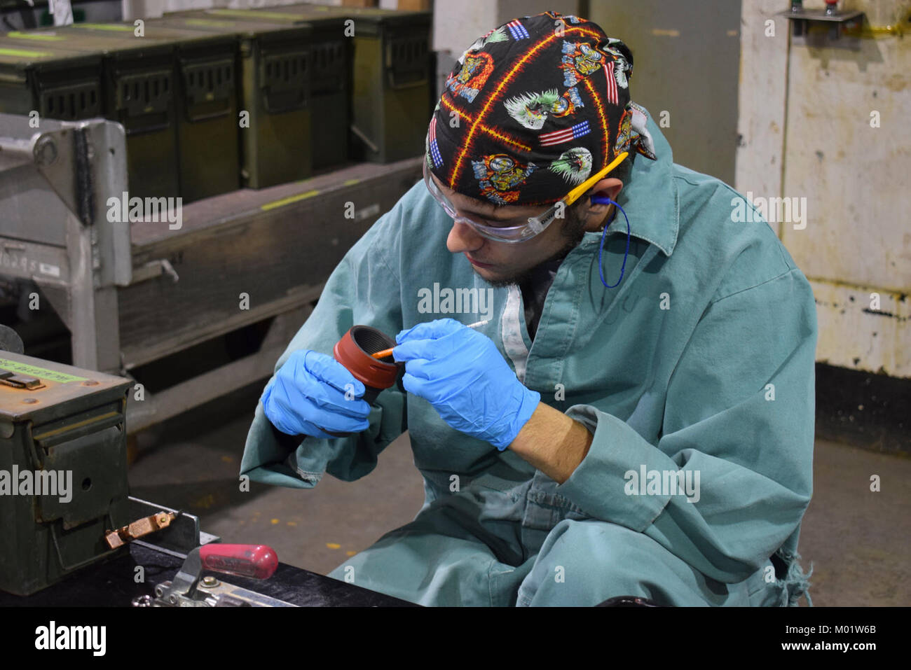 Crane Army employees manufacture rounds for the MK 45 five-inch gun ...