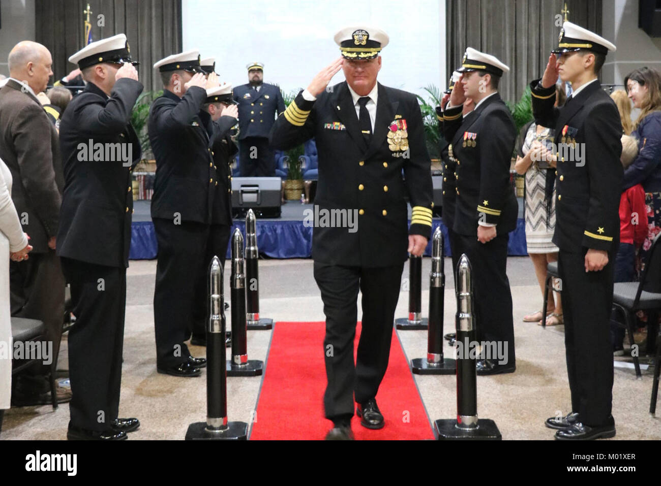 U.S. Navy Capt. Greg Ireton is piped ashore after being relieved by ...