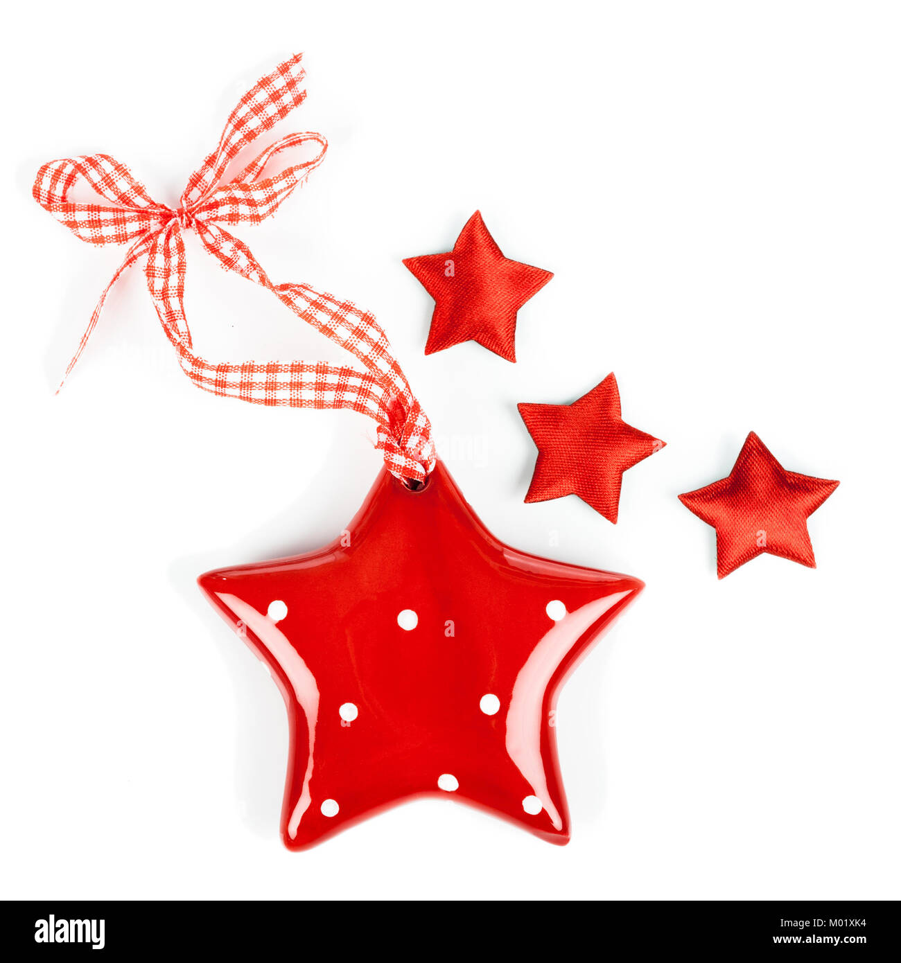 Red Christmas stars on white background Stock Photo - Alamy