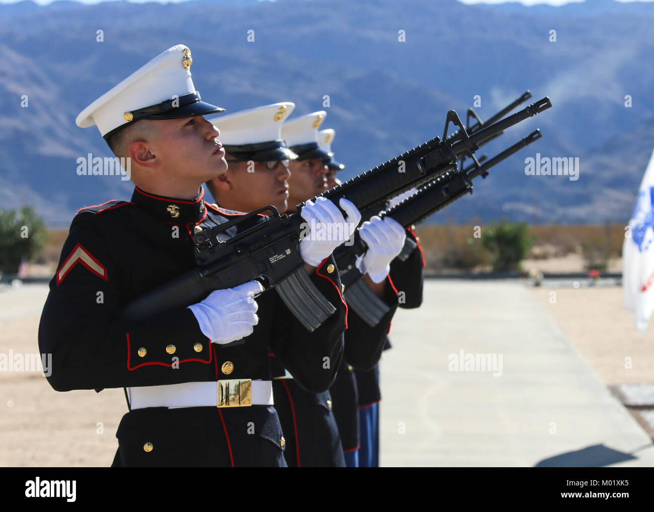 Marines render a rifle salute at the funeral ceremony of Ray V. Wilburn ...