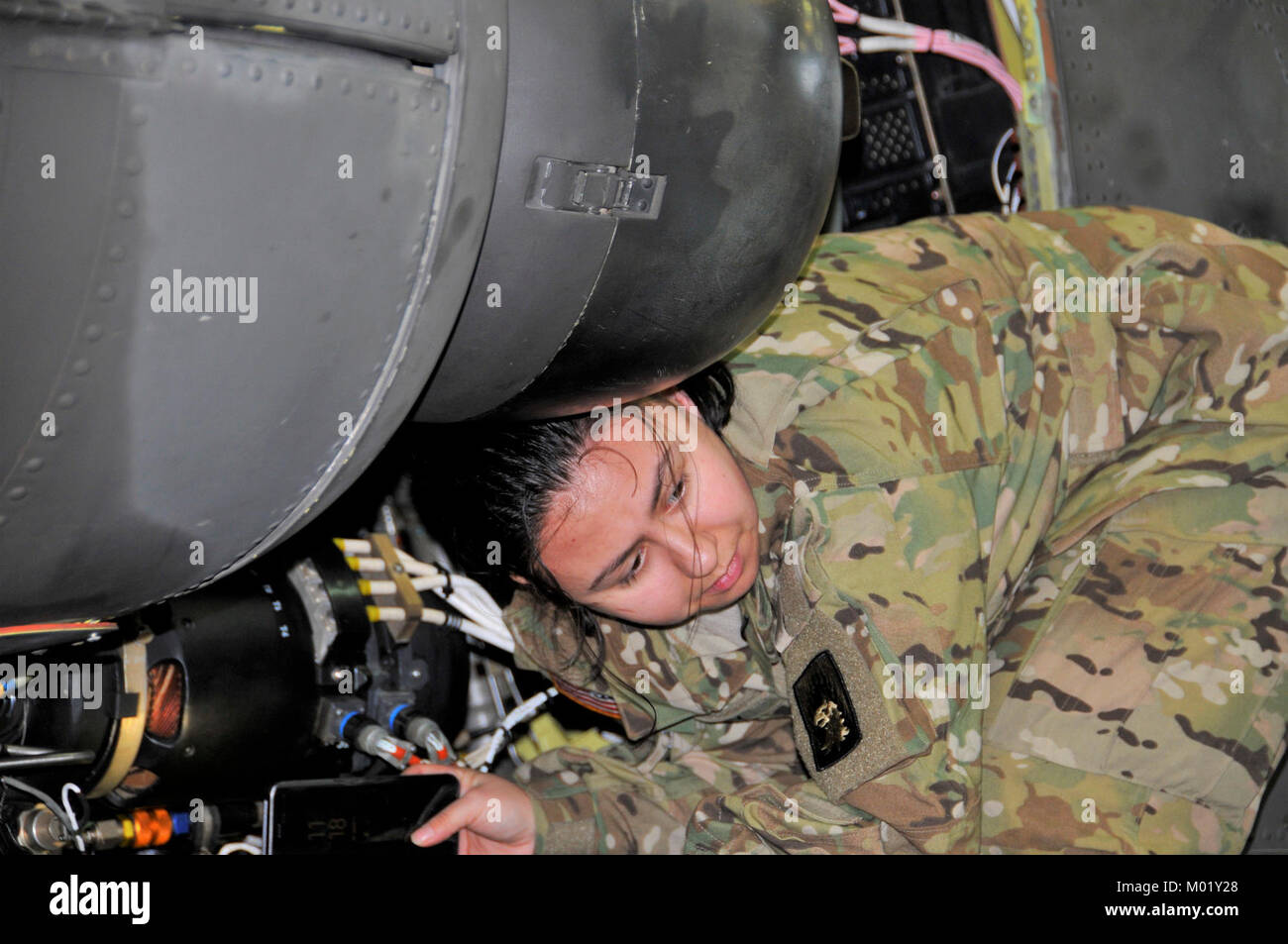 U.S. Army Pfc. Britney Moody, an AH-64D Apache Longbow helicopter ...