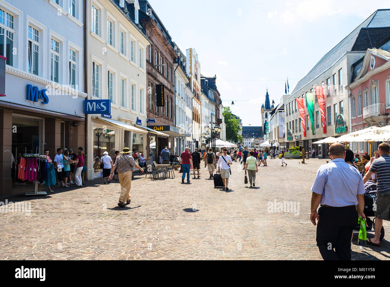 TRIER, GERMANY - JUNE 28, 2010: people on Simeonstrasse street and view ...