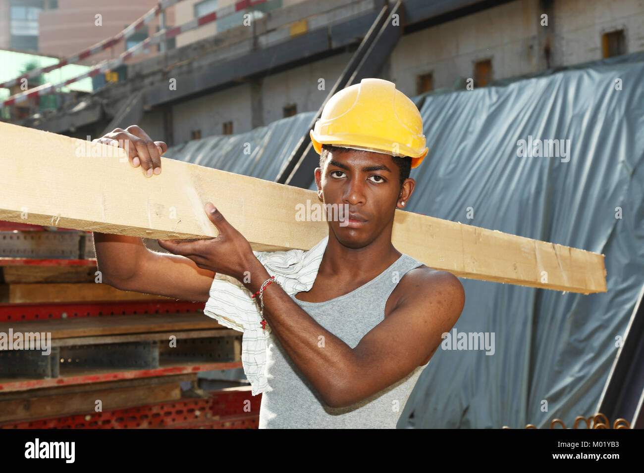 young black man working in construction site Stock Photo - Alamy
