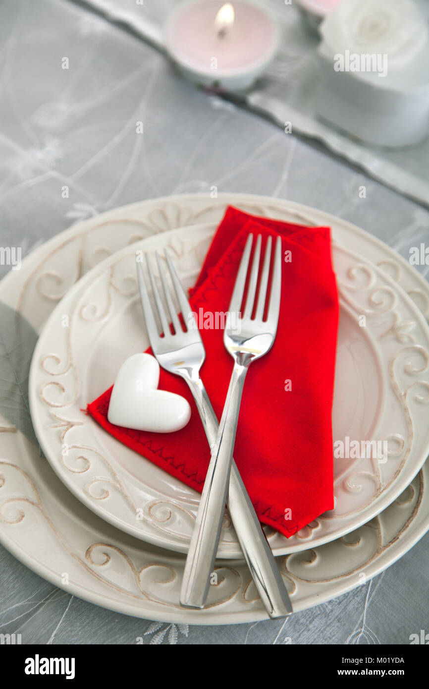 Valentines day table. Plate with two forks and hearts. Valentine's day ...