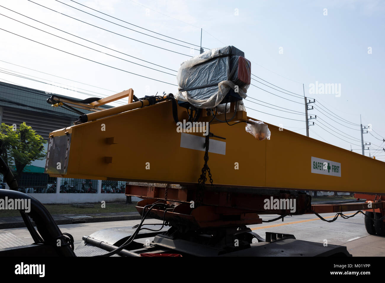 yellow overhead crane beam deliveried by truck ; for factory equipment ...