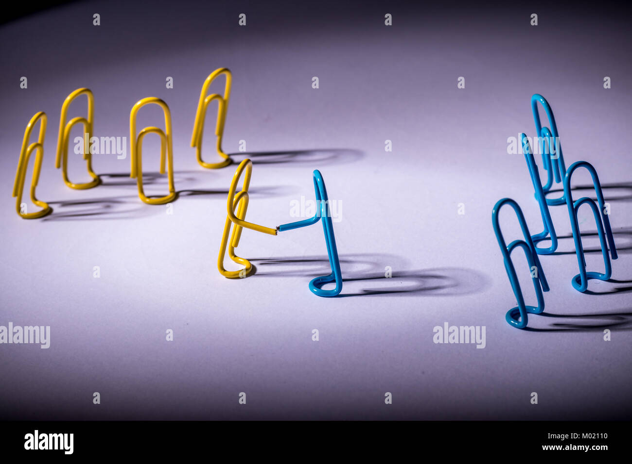 life of paper clips stalking people's problems Stock Photo - Alamy