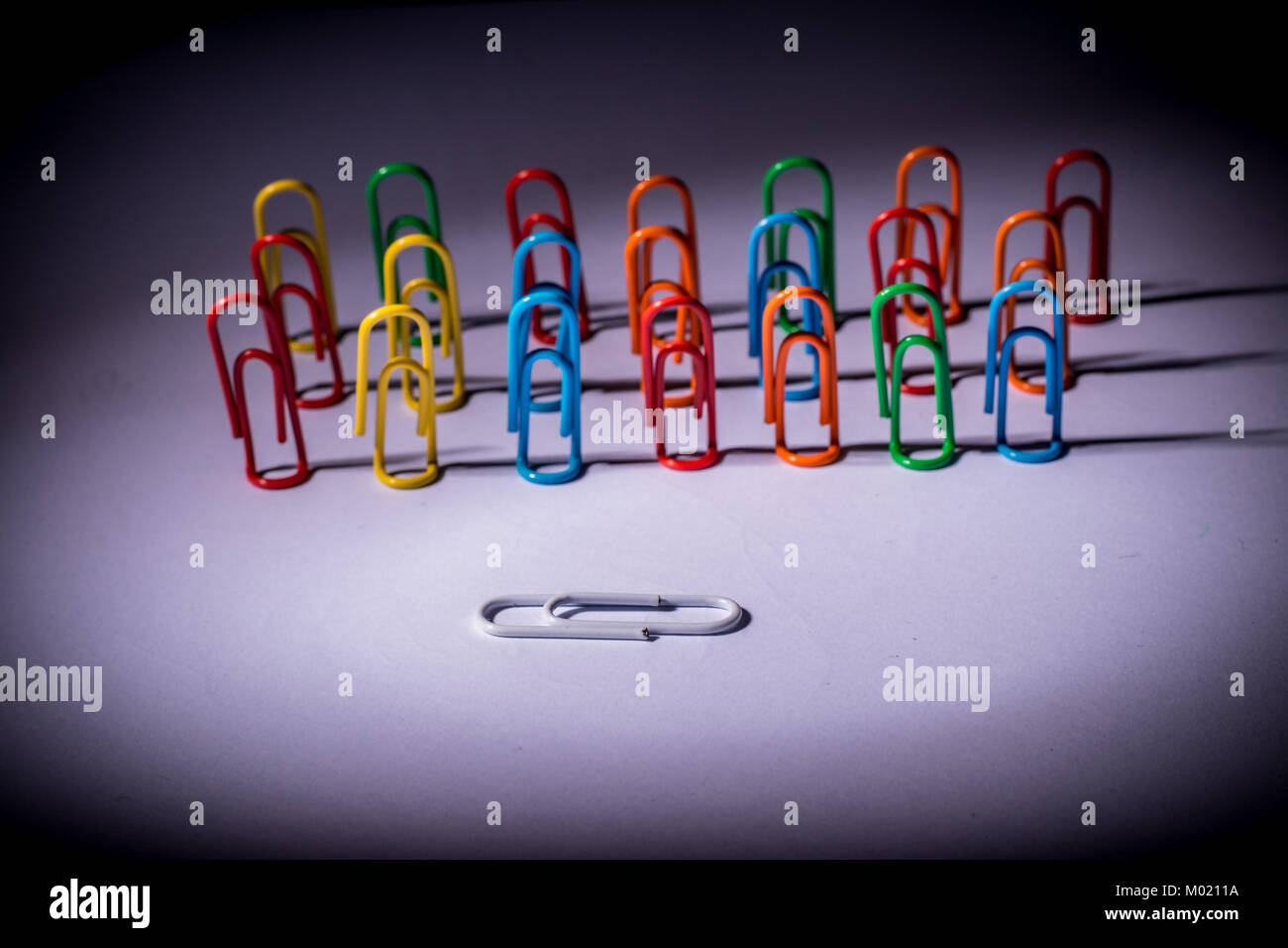 life of paper clips stalking people's problems Stock Photo - Alamy