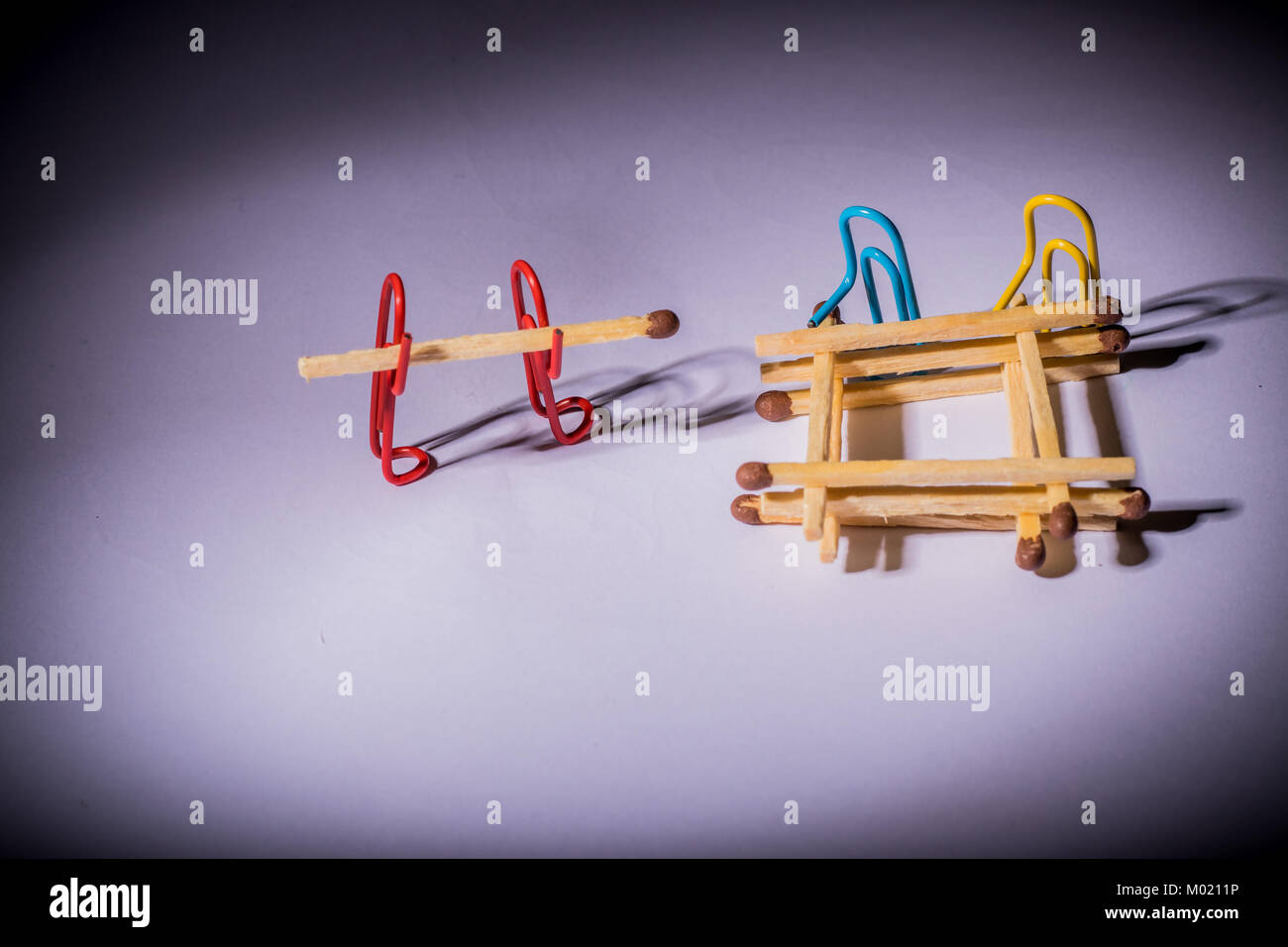 life of paper clips stalking people's problems Stock Photo - Alamy