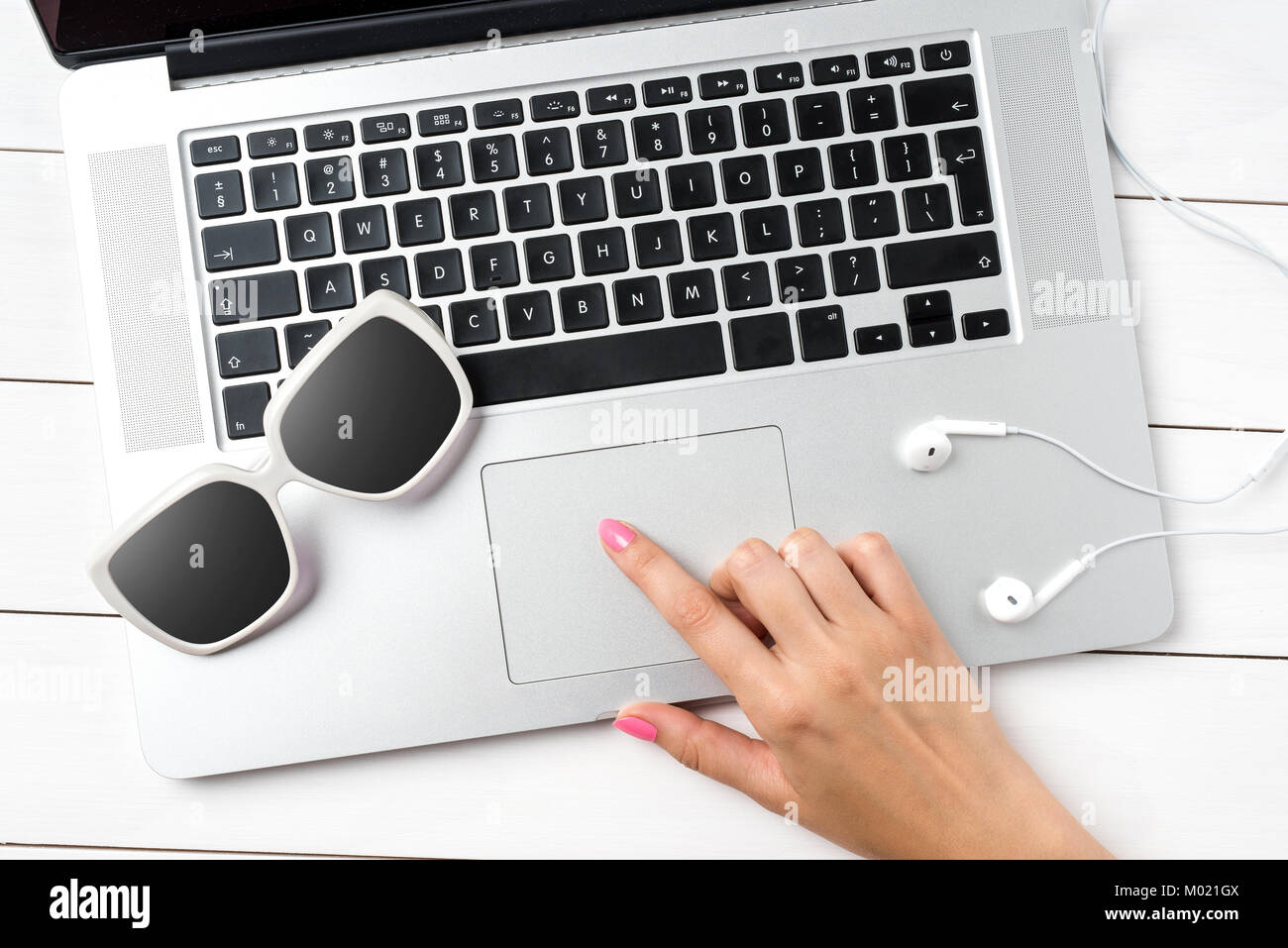 Using laptop with headphones hi-res stock photography and images - Alamy