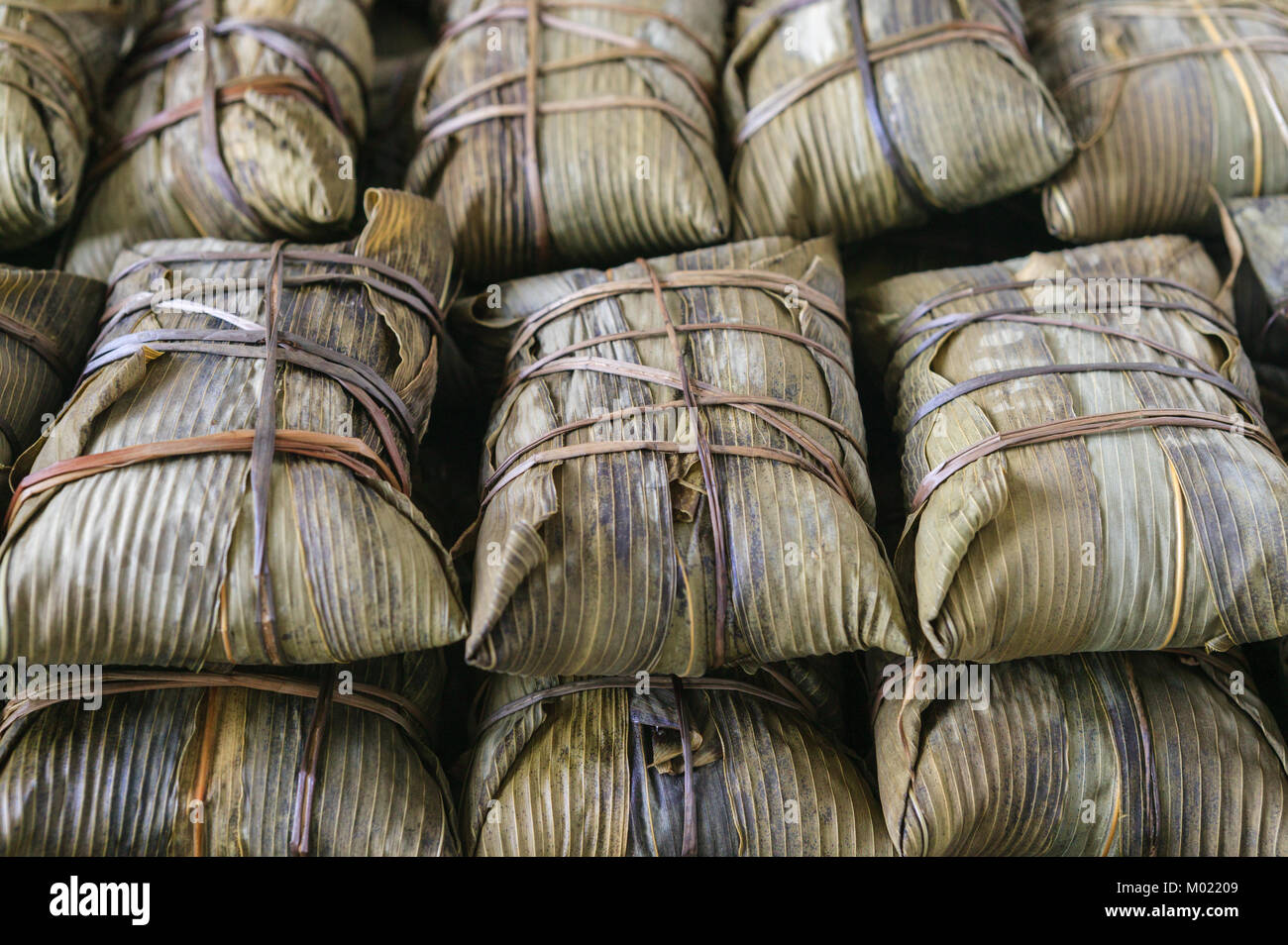 Home made delicious Chinese rice dumplings wrapped in bamboo leaf Stock ...