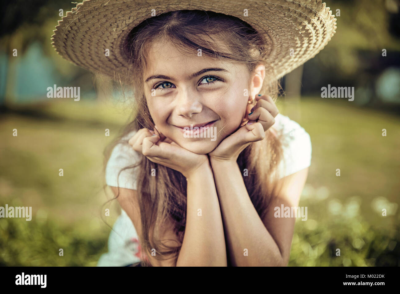 Summer portrait of a pretty, smiling child Stock Photo - Alamy