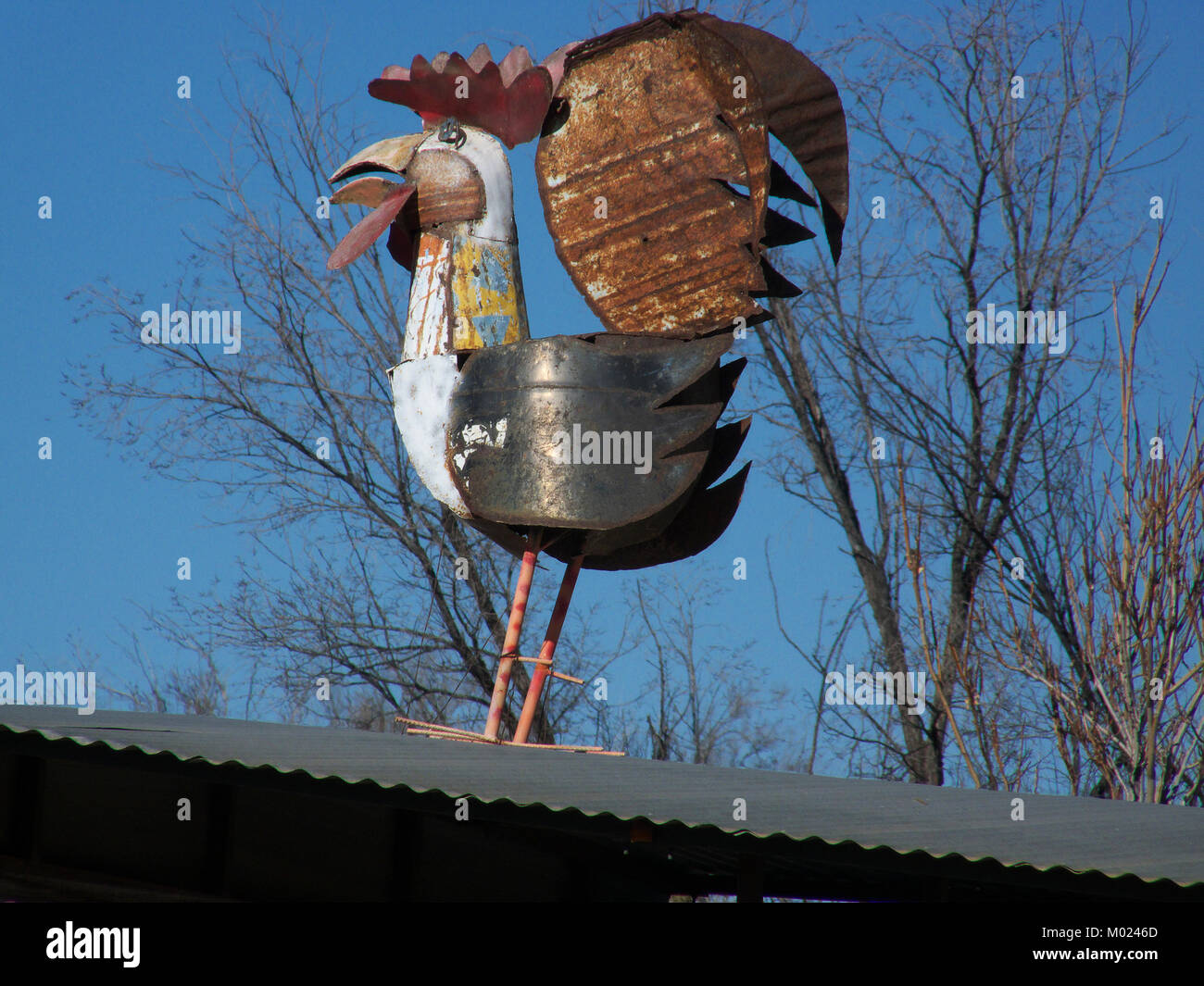 rooster sculpture on roof Stock Photo - Alamy