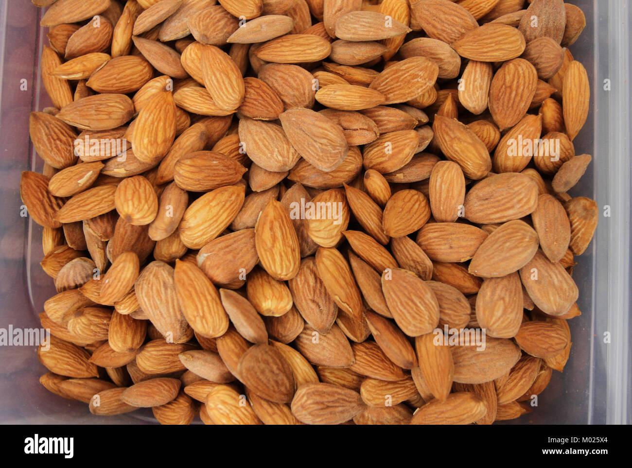 Almonds. Raw fresh organic almond nuts. Almond background. Nuts ...