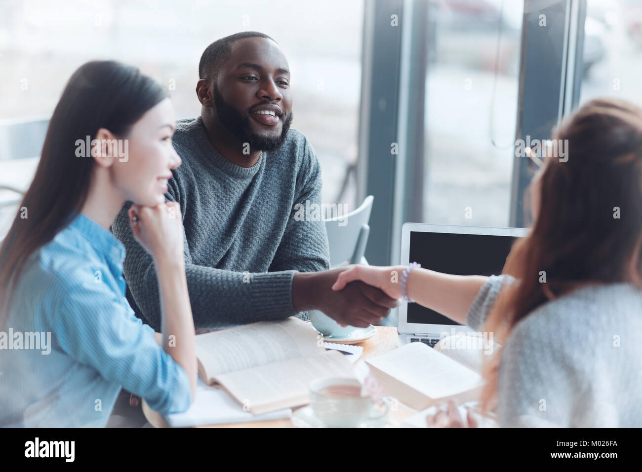 Positive foreign man looking at his opponent Stock Photo - Alamy