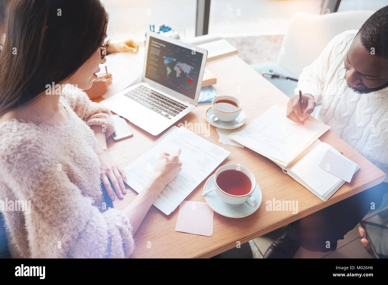 Very attentive woman making some notes Stock Photo - Alamy
